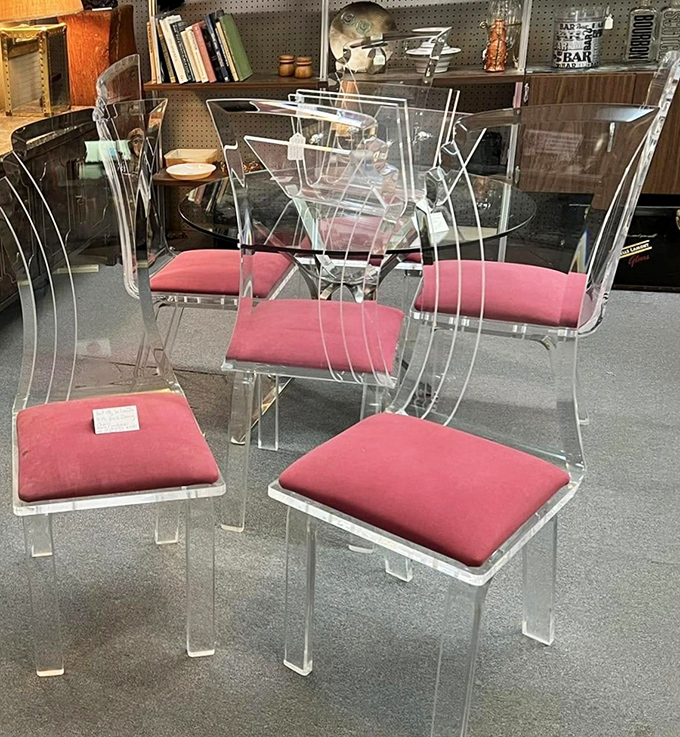 Lucite dining chairs that would make The Jetsons jealous. Mid-century modern at its finest &ndash; transparent yet somehow substantial.