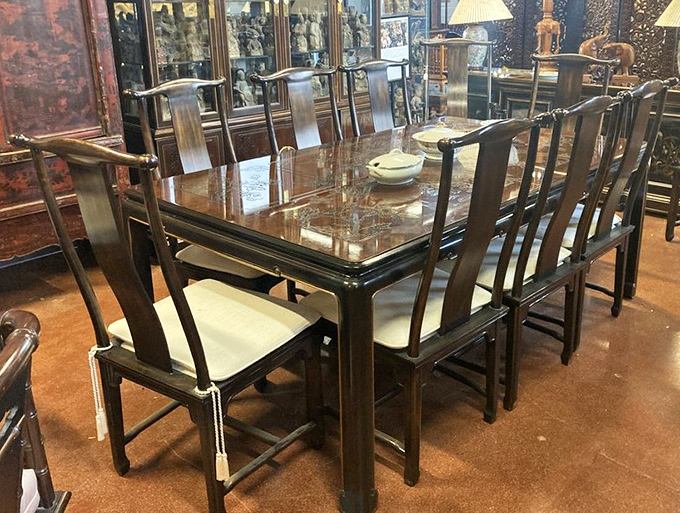 This elegant Asian-inspired dining set isn't just furniture—it's a time machine to more formal dinners where nobody stared at their phones.
