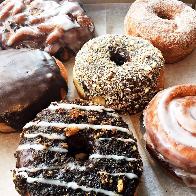 A box of Dottie's treasures showcases their range, from chocolate-dipped masterpieces to nut-crusted creations that make vegans and non-vegans swoon equally.