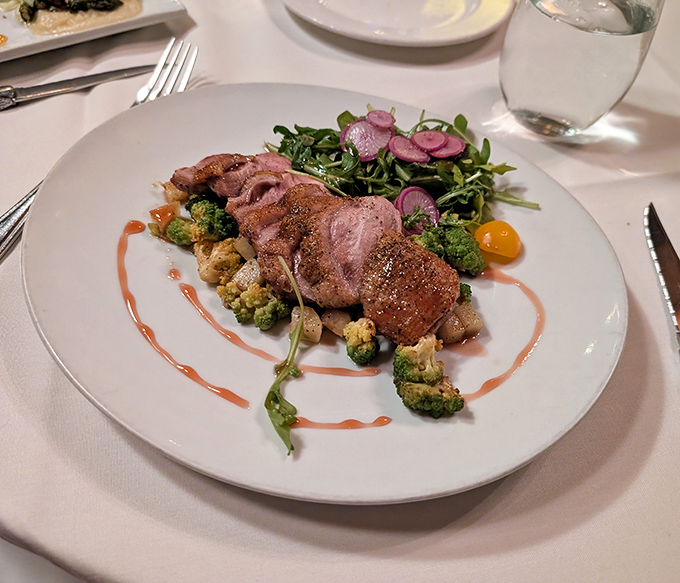 Duck breast cooked to that magical sweet spot between rare and medium-rare. The pink center practically winks at you with delicious promise.