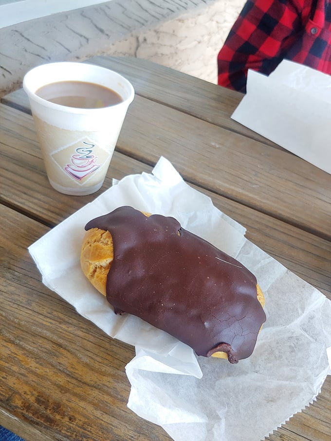 The chocolate-dipped éclair – half pastry, half miracle. Paired with no-nonsense coffee, it’s the breakfast of champions who don’t count calories.