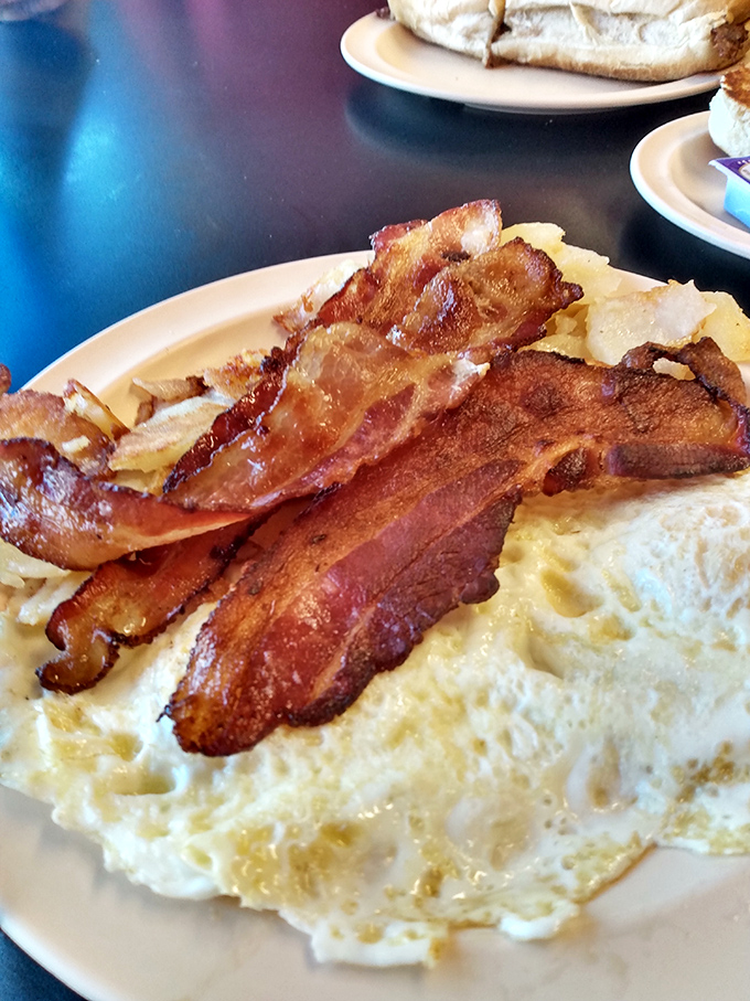 Bacon that's achieved the perfect balance between crispy and chewy. Laid across eggs like the crown jewels of breakfast royalty.