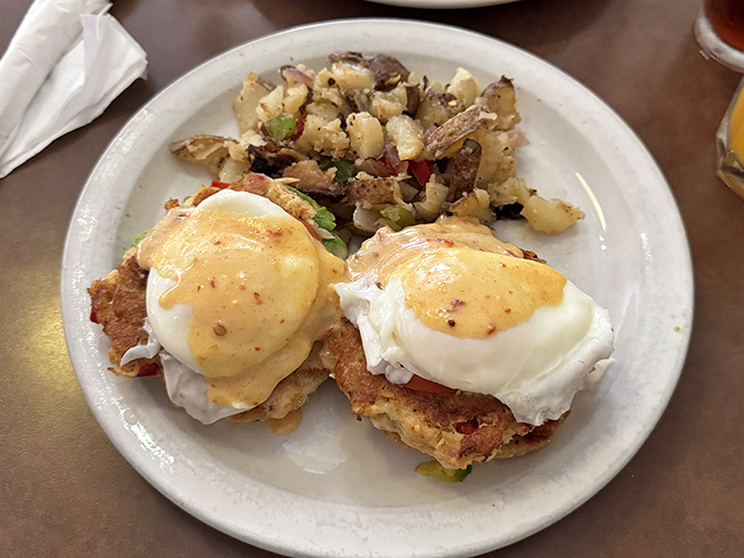 Eggs Benedict done right: perfectly poached eggs with hollandaise that's silky enough to make you forget you're essentially eating breakfast-approved mayo.