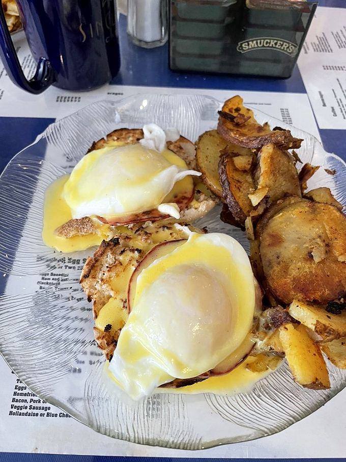 Eggs Benedict done right&mdash;where hollandaise sauce cascades like a yellow waterfall over perfectly poached eggs. Breakfast architecture at its finest.