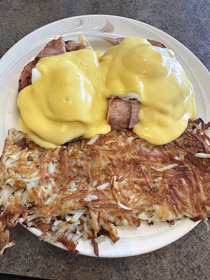 Eggs Benedict done right&mdash;crispy hash browns, perfectly poached eggs, and hollandaise sauce that would make a French chef nod in approval.