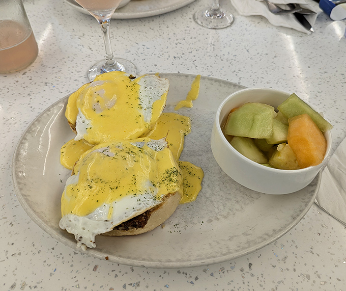 Eggs Benedict done right &ndash; perfectly poached eggs wearing sunny hollandaise jackets atop a throne of English muffins.