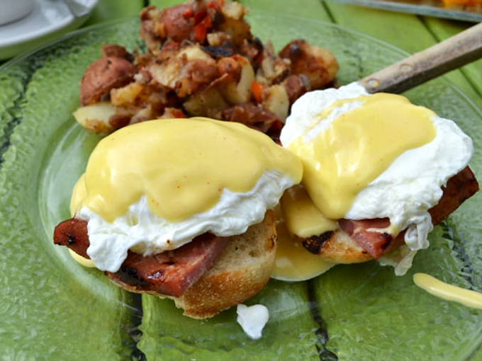 These eggs Benedict aren't just breakfast; they're a sunrise celebration with hollandaise so golden it deserves its own Fort Knox.