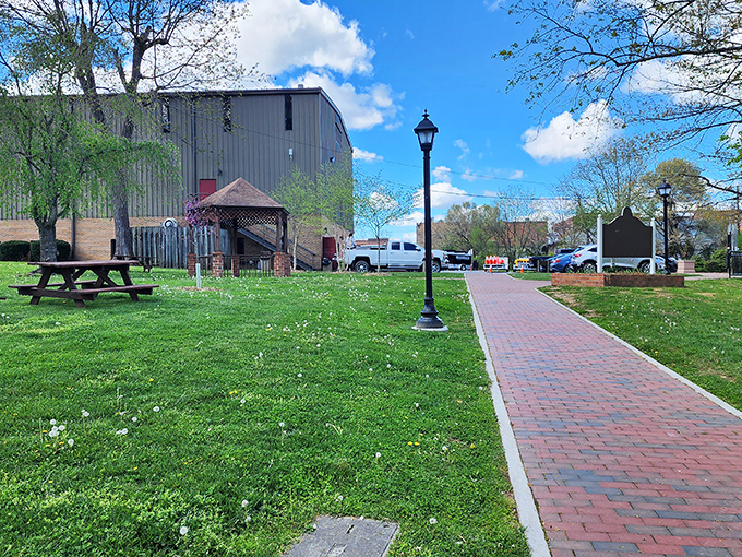 Elizabeth Brown Park's brick pathway invites leisurely strolls, proving that sometimes the best amenities in retirement are the simplest pleasures.
