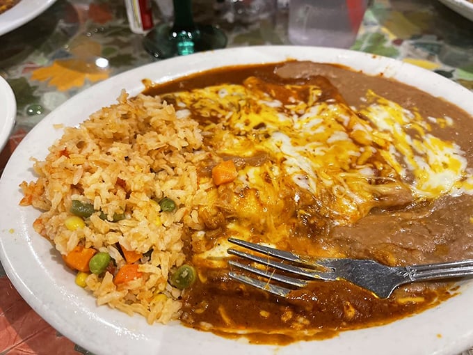 When enchiladas meet eggs, magic happens. The sauce doesn't just cover the dish&mdash;it embraces it like a warm, spicy blanket.