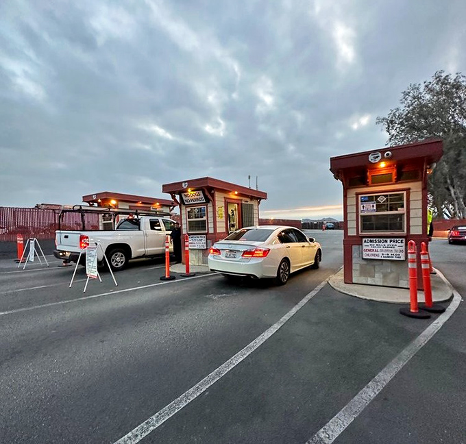 The entrance booths stand like sentinels of fun, where ticket-takers have welcomed generations of moviegoers to their automotive theater seats.
