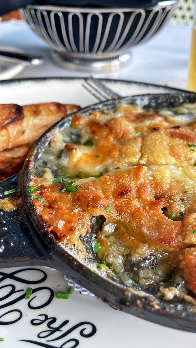 Bubbling cheese blankets this escargot dish like a French countryside duvet&mdash;comfort food with a sophisticated passport.
