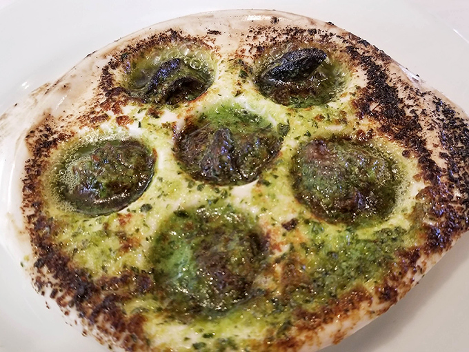 Escargots that would make even the most skeptical diner say, "Well, hello there, little butter-drenched flavor bombs!" Garlic breath never looked so good.