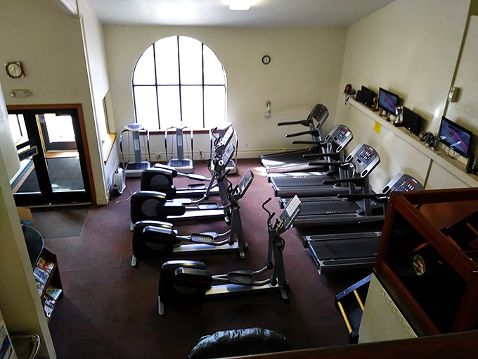 Small-town fitness centers: where the equipment might be modest, but nobody's judging your workout outfit or hogging the treadmill for a selfie session.