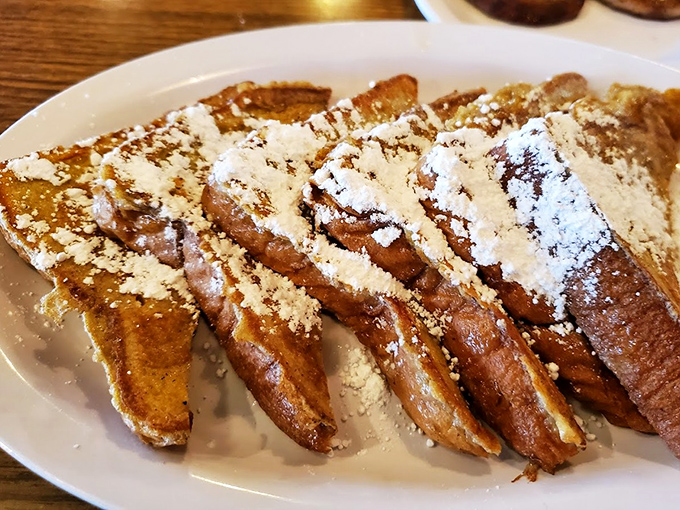 French toast that makes you question why anyone bothers with fancy brunch spots. Perfectly golden, dusted with powdered sugar, and ready for its close-up.
