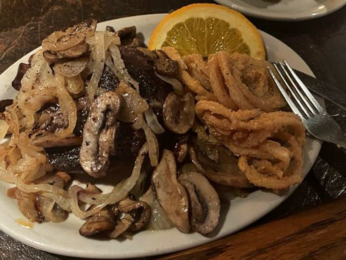 A steak adorned with sautéed mushrooms and caramelized onions—proof that sometimes the classics become classics for a very good reason.