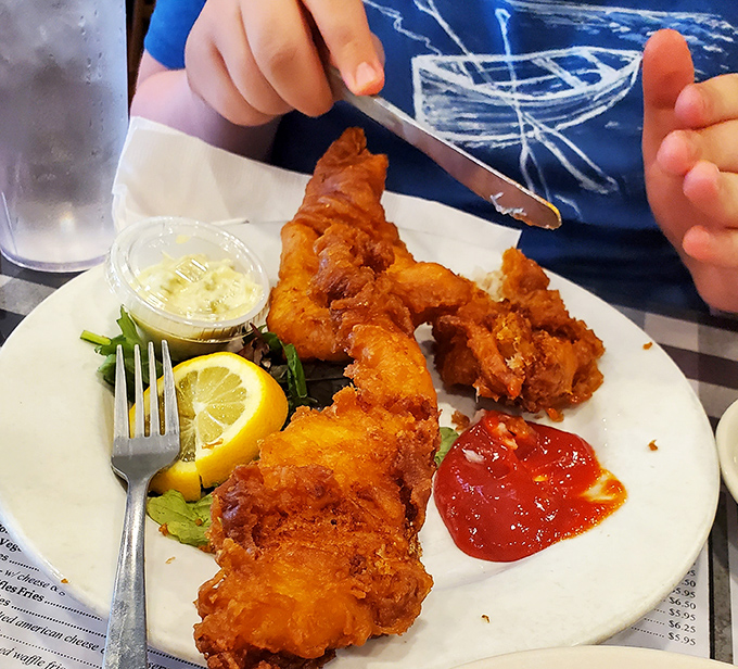Golden-battered chicken tenders that crunch louder than your dad's favorite recliner. Dipping sauce not optional, but necessary.