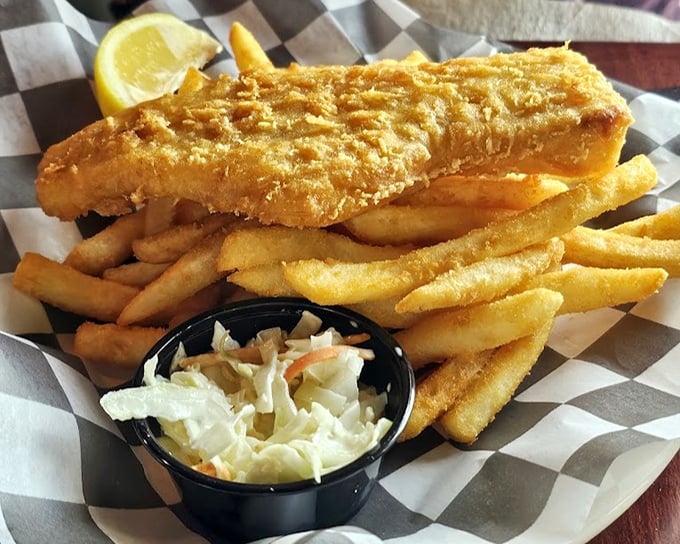 Golden-battered fish that shatters like glass alongside fries that could make a Frenchman weep. Simple food done extraordinarily well.