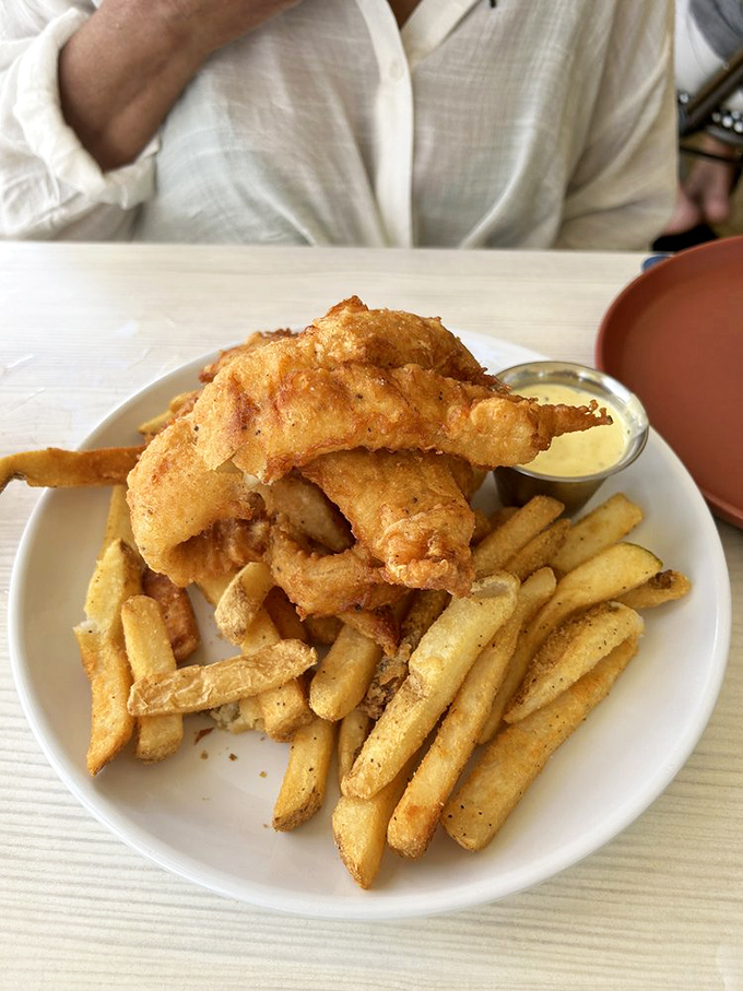 Fish so fresh it practically winks at you, wearing a golden batter jacket that crackles with each bite.