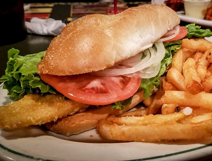 The fish sandwich arrives like an edible postcard from Lake Erie—crispy, fresh, and substantial enough to make a New Englander nod with respect.