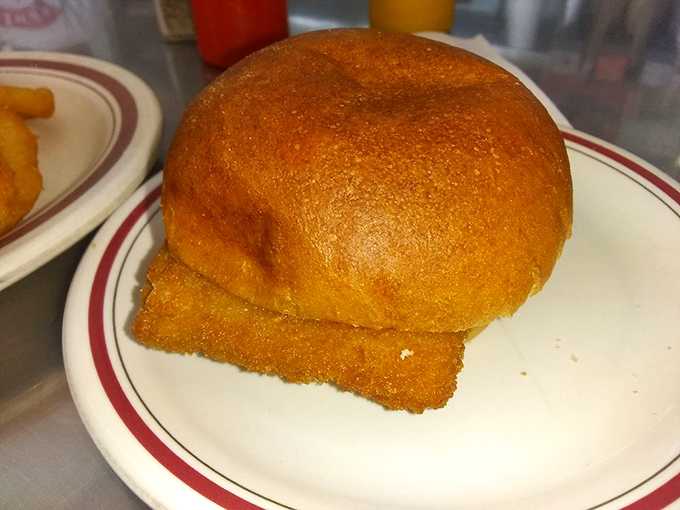 This golden fish sandwich delivers oceanic satisfaction with that perfectly toasted bun embracing fresh fillings.