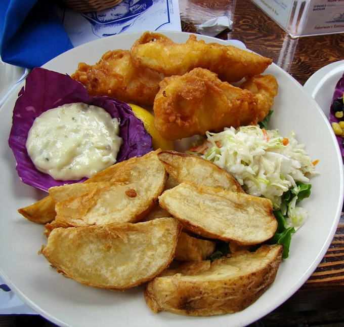 Fish and chips that would make a British pub jealous, with potato wedges thick enough to use as currency in some coastal kingdoms.