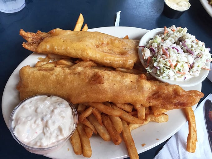 Golden-battered fish and chips with creamy coleslaw—proof that Fitz's knows their way around savory comfort food just as well as their famous floats.