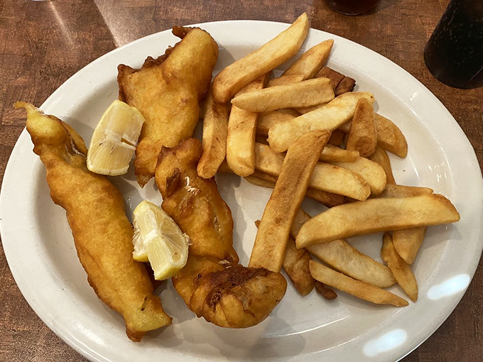 Fish and chips that would make a British pub jealous &ndash; golden, crispy batter protecting flaky white fish alongside perfectly cooked fries.