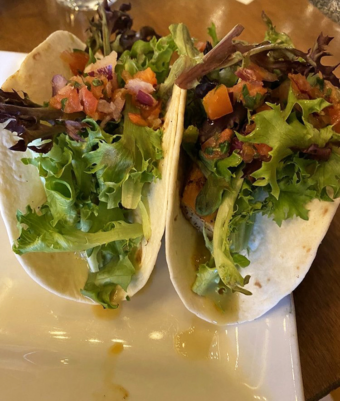 These aren't just fish tacos; they're edible art. Fresh greens and vibrant salsa create a fiesta of flavors that dance across your palate.