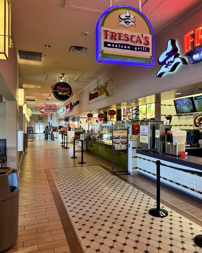 The food court's neon glow beckons hungry shoppers with promises of Mexican cuisine at Fresca's&mdash;fuel for the retail marathon ahead.
