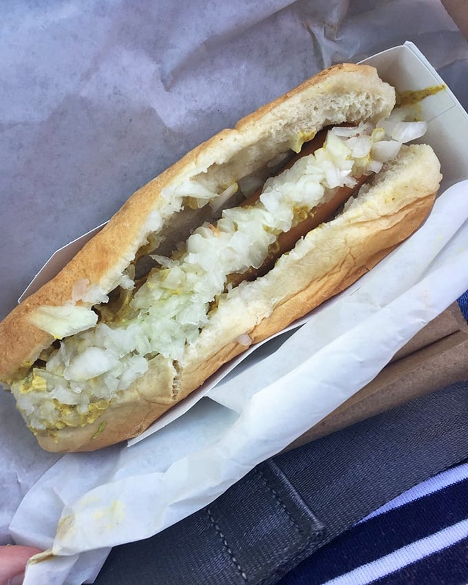 The Foot Long Slaw Dog proves that sometimes more is more &ndash; a perfect harmony of savory dog and creamy slaw that makes taste buds dance.