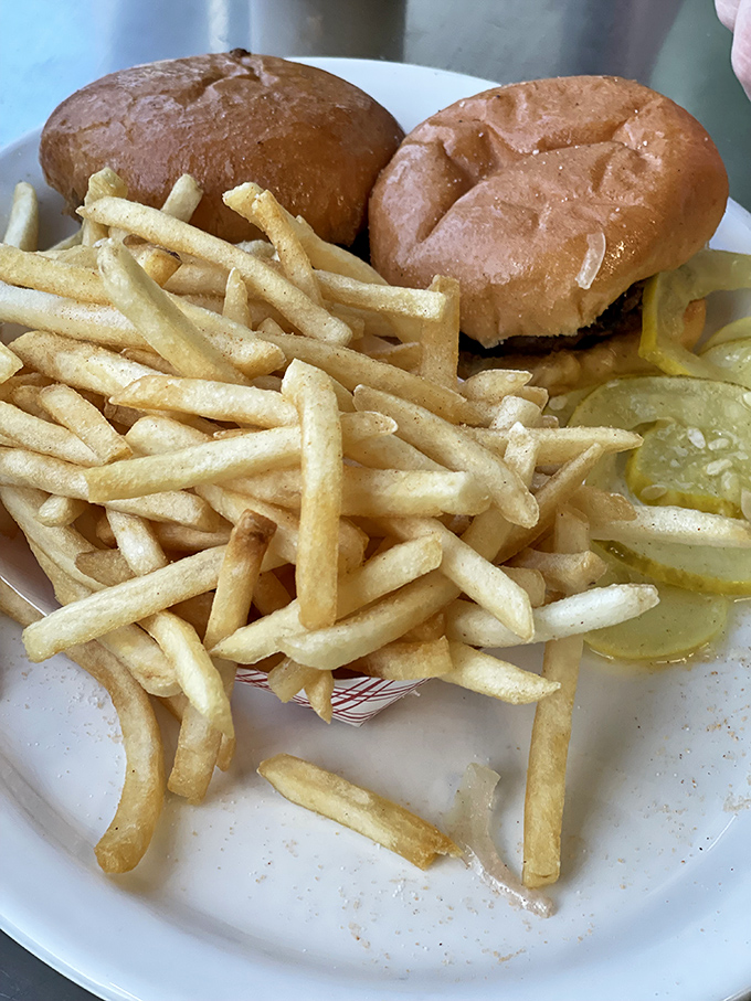 Golden fries, crisp pickles, and sliders in perfect harmony&mdash;a plate that proves simplicity is the ultimate sophistication in comfort food.