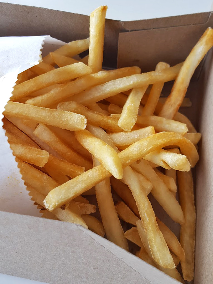 These golden fries aren't just a side—they're supporting actors deserving of their own Oscar, crisp on the outside, fluffy within, and utterly irresistible.