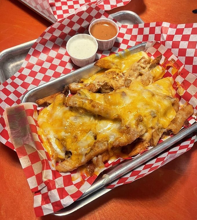 Loaded cheese fries that require a game plan: Do you start at the edges and work in, or dive straight for the middle?