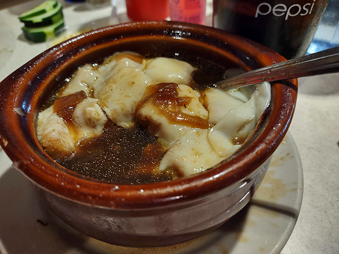 French onion soup that doesn't mess around &ndash; a hearty crock of savory broth, tender bread, and melted cheese that demands a moment of silence.