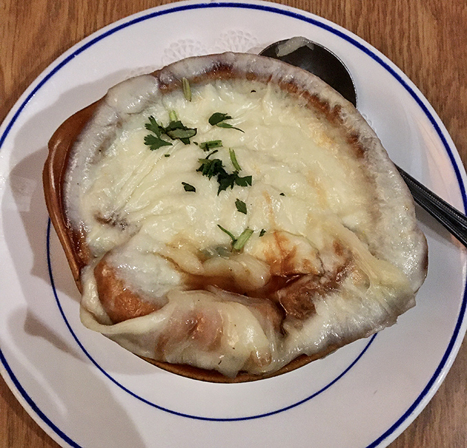 This isn't just French onion soup&mdash;it's a cheese pull championship waiting to happen. Dive beneath that melty canopy to find rich, savory broth.