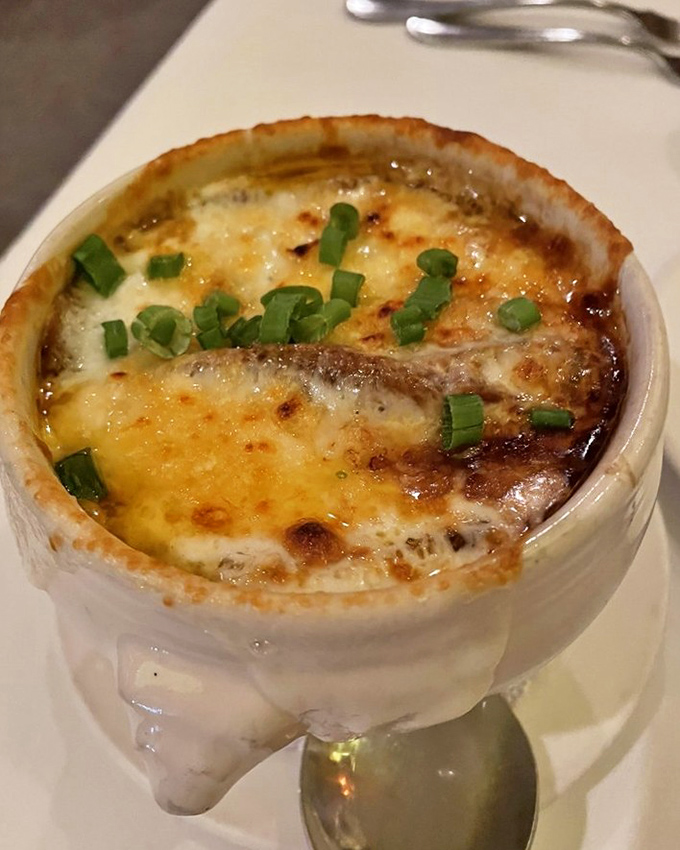 French onion soup that's achieved the golden trifecta: sweet caramelized onions, rich broth, and a cheese cap that requires commitment to break through.
