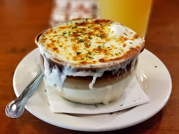 French onion soup that's wearing a melted cheese beret. Breaking through that broiled canopy reveals a savory treasure worth every spoonful.
