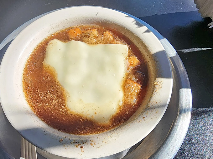 French onion soup that doesn't mess around &ndash; a rich broth crowned with a blanket of melted cheese that stretches with each spoonful.