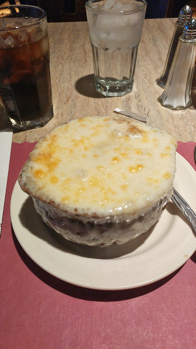 French onion soup that's worth the cheese pull. That golden cap of bubbling Swiss is the winter coat your taste buds have been dreaming about.