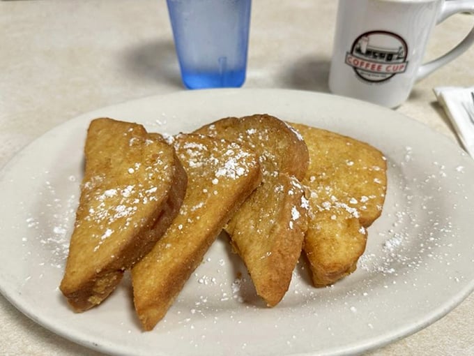 French toast that doesn't need a passport to impress &ndash; golden, crispy edges, dusted with powdered sugar, and waiting patiently for your maple syrup baptism.