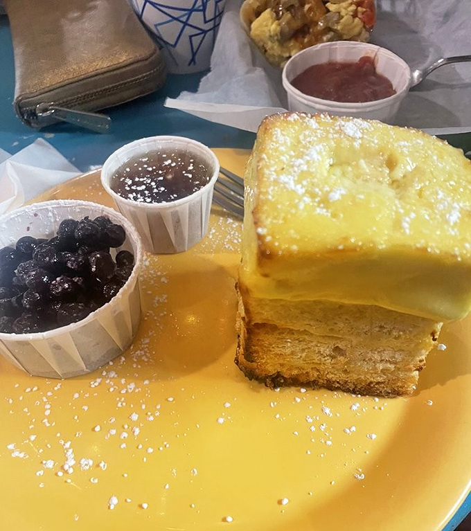 French toast that's dressed for success! With blueberries, syrup, and powdered sugar, it's the breakfast equivalent of wearing a tuxedo to the beach.