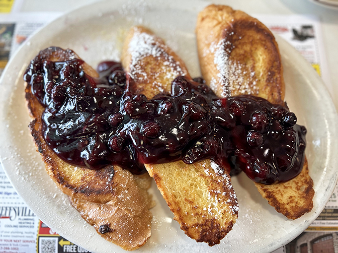 French toast that puts ordinary breakfast to shame, crowned with a berry compote that would make your grandmother both proud and jealous.
