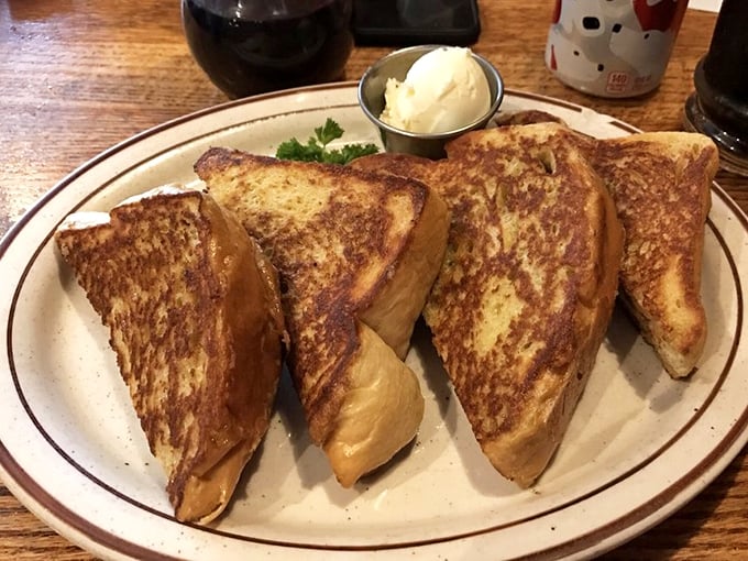 French toast that makes you question every other breakfast decision you've ever made. Golden, crispy edges hiding custardy perfection within.