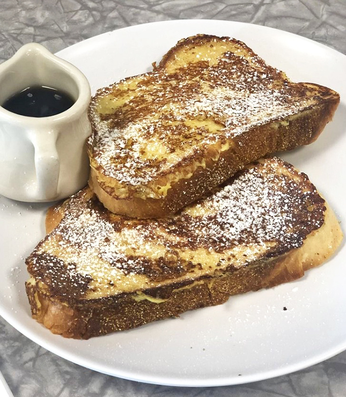 French toast that's achieved the golden ratio of crispy exterior and custardy interior. That dusting of powdered sugar isn't just pretty&mdash;it's necessary.