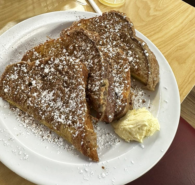 French toast that makes you question every other breakfast you've ever had. That dusting of powdered sugar isn't just garnish &ndash; it's magic.