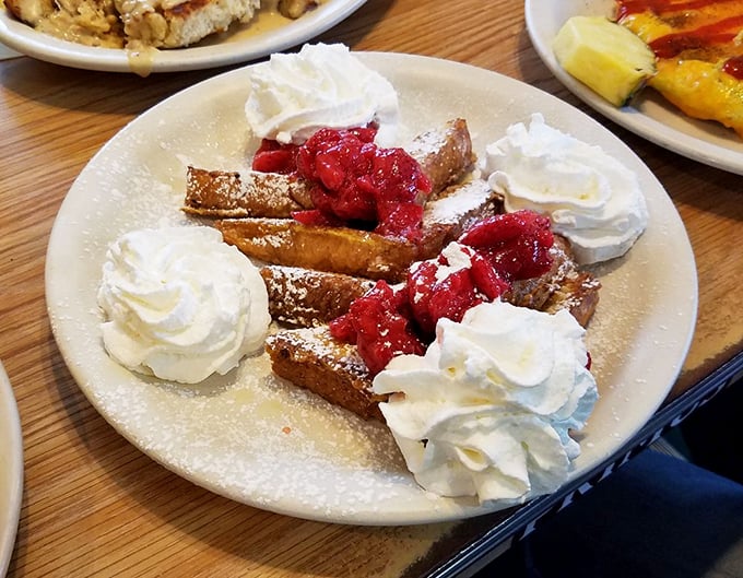French toast dressed in berries and whipped cream transforms ordinary mornings into sweet celebrations.