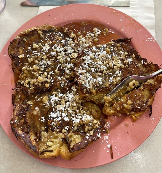 French toast that makes regular bread weep with jealousy. Those walnuts aren't just toppings&mdash;they're crunchy little flavor bombs.