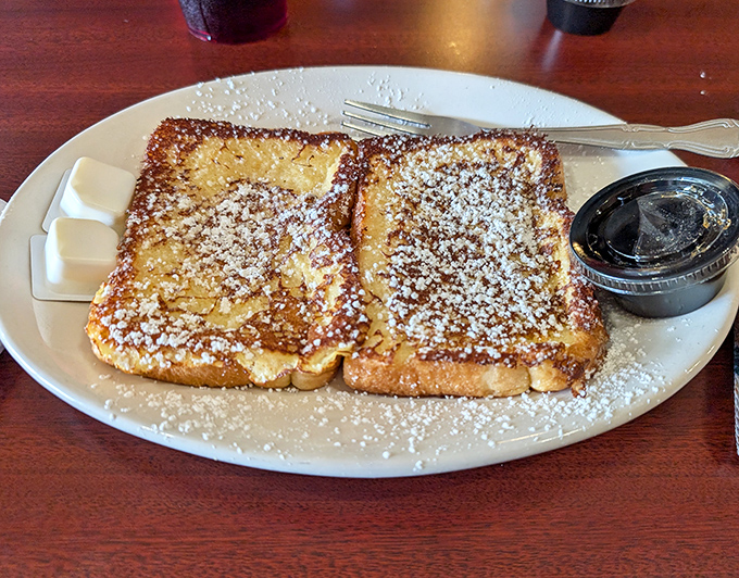 French toast dusted with powdered sugar like fresh snow on a winter morning&mdash;proof that sometimes the simplest pleasures are the most satisfying.