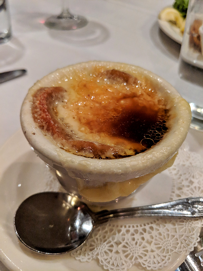 The cr&egrave;me br&ucirc;l&eacute;e's caramelized top awaits your spoon's satisfying crack. One tap and you're transported to dessert paradise.
