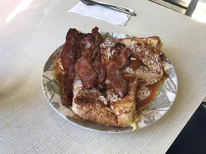 French toast and bacon: the breakfast equivalent of Astaire and Rogers, dancing together in perfect harmony on a plate that screams "good morning" in the most delicious way.
